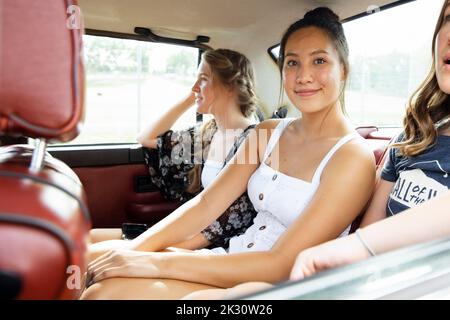 Teenage girls riding in car together Stock Photo - Alamy
