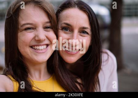 Cheerful women having fun together at beach Stock Photo - Alamy
