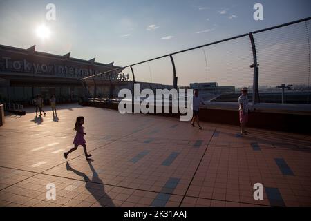 People on the observation deck of Haneda International Airport Terminal ...