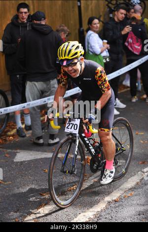 Tetsuo Nomoto (rider No. 270) straining as they race up Swains Lane in ...