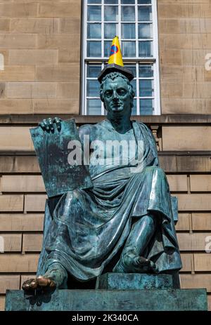David Hume bronze statue with rubbed foot and traffic cone on his head ...