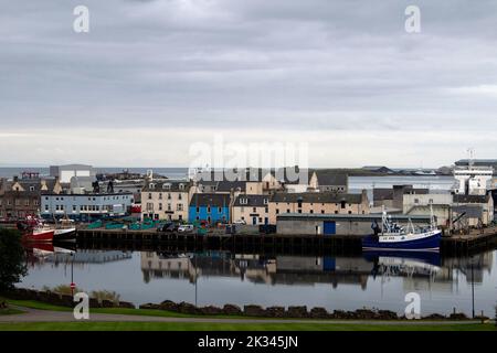 Rows of houses and shops lining the seafront at Stornoway harbour ...