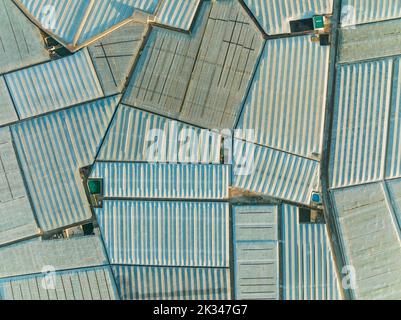Masses of shimmering plastic greenhouses near El Ejido, aerial view ...