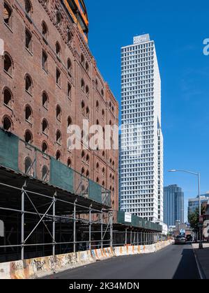 One South First Street, an apartment tower, leans on Ten Grand Street ...