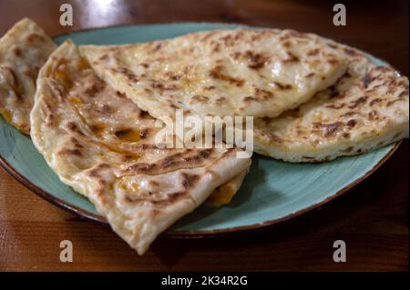 Traditional Chechen dish Chepalgash baked from yogurt flour and eggs ...