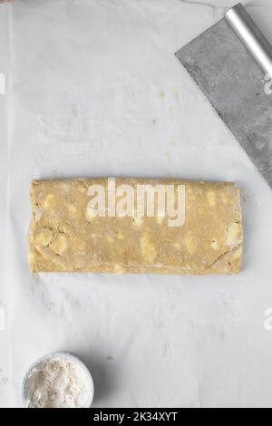 danish pastry dough being laminated, pastry dough with pieces of cold ...