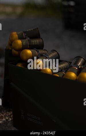 High Explosive Dual Purpose 40mm rounds are staged for firing during a ...