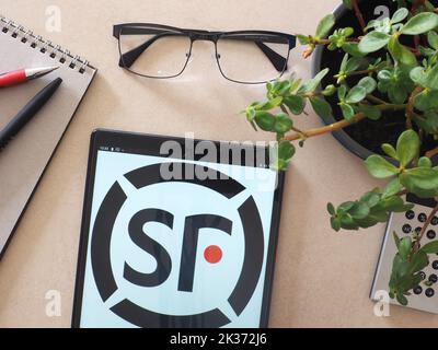 In this photo illustration, SF Express logo seen displayed on a tablet ...