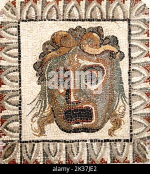 roman mosaic of small polychrome marble pieces with a human face Stock Photo - Alamy