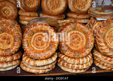 Tandyr nan, tandoor bread, sold in Kyrgyzstan. Central market in ...