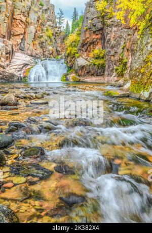 waterfall and fall colors along tenderfoot creek in the little belt ...