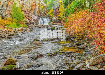 waterfall and fall colors along tenderfoot creek in the little belt ...
