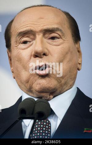 Forza Italia's president Silvio Berlusconi takes his seat in the ...