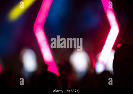 Bright pink stripes of optical bokeh on a dark background Stock Photo ...