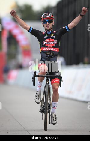 Belgian Eli Iserbyt celebrates as he crosses the finish line to win the ...