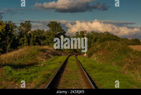 Old non electrified railway track near Rakovnik town in sunset color ...