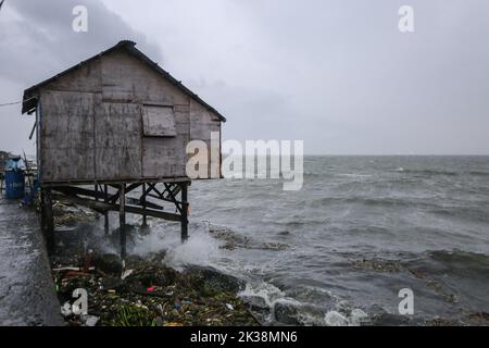 September 25, 2022, Baseco, Manila, Philippines: A woman along with her ...