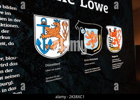 22 July 2022, Dusseldorf, Germany: Parents with children take a tour of ...