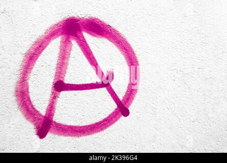 Pink anarchy symbol on wall. Ideal for textures, backgrounds and ...
