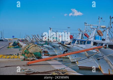 A scenic shot of boats ducked in the coastal city of Piran Slovenia ...