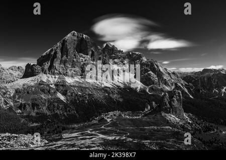A scenic grayscale of rocky Dolomitic Mountains in Italy with a ...