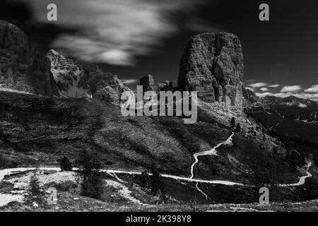 A scenic grayscale of rocky Dolomitic Mountains in Italy with a ...