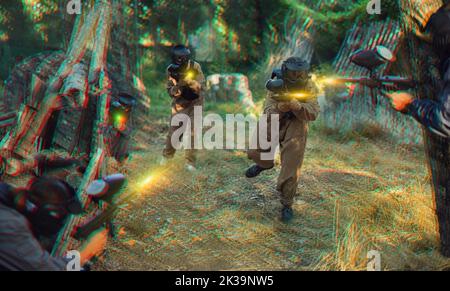 Tactical paintball team fighting on outdoor location Stock Photo - Alamy
