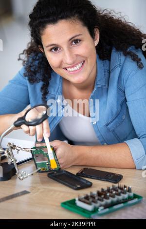 female engineer testing circuit board Stock Photo - Alamy