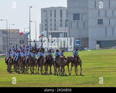 Police on camel in traditional clothes in Doha, Qatar. Doha has a ...
