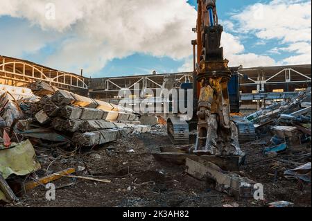 Excavator destroyer removes debris winter day Stock Photo - Alamy