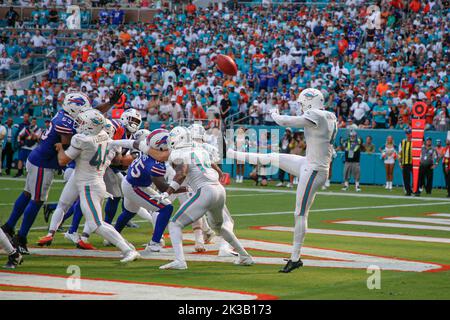 Miami Dolphins punter Thomas Morstead (4) holds the ball as Miami ...