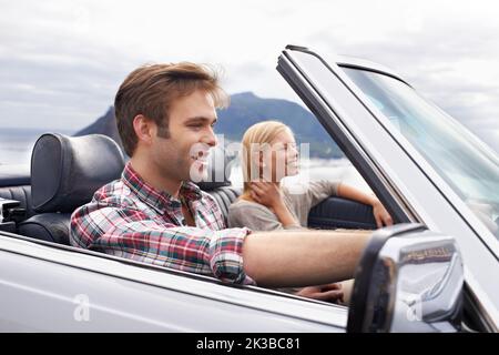 Young couple in a convertible car Stock Photo - Alamy