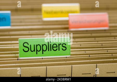 Hanging file folder labeled with Suppliers Stock Photo - Alamy