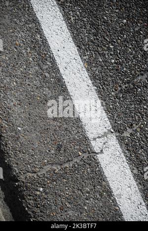 Roadside closeup with a white painted line Stock Photo - Alamy