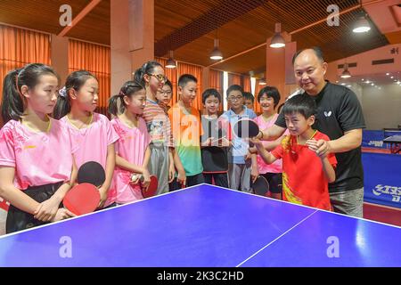 HEFEI, CHINA - SEPTEMBER 23, 2022 - Coach Kong Guoping guides a student ...