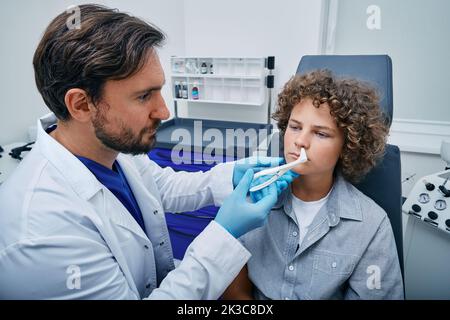 Rhinoscopy of child nose. Consultation with doctor. Children ...
