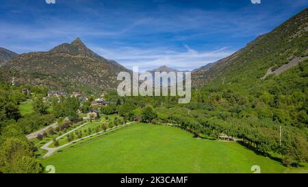 Aerial view of Ribera de Cardós and the surrounding green fields in the ...