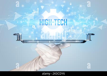 Waiter serving new technology concept Stock Photo - Alamy