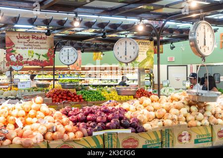 Hanging scales in the greengrocers section of a supermarket for ...