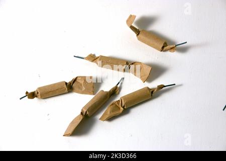 A closeup of small firecrackers on a white background Stock Photo - Alamy