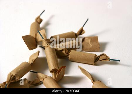 A closeup of small firecrackers on a white background Stock Photo - Alamy