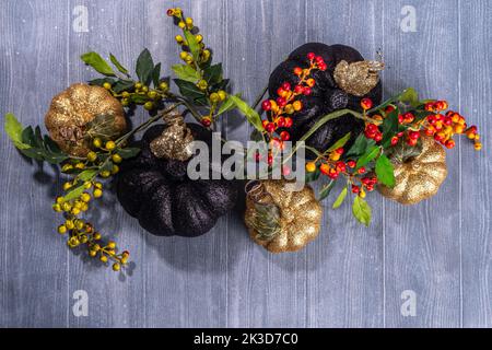 Black and cold colored pumpkins on gray wooden background. Minimalist ...