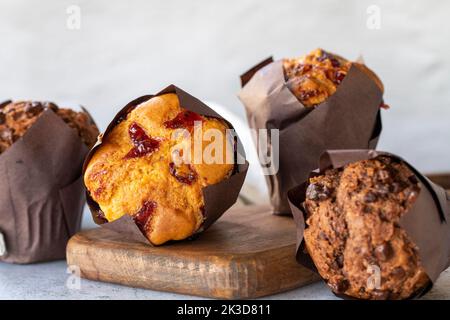 Muffins cake. Bakery products. Chocolate and fruit cake on gray ...