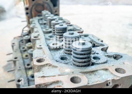 Old oil stains on pistons in the eight engine blocks or called cylinder ...