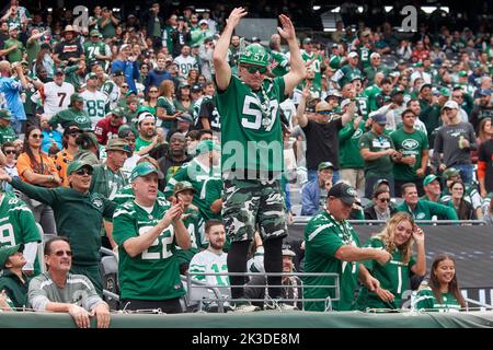 New York Jets fans cheer during the second half of an NFL football game ...