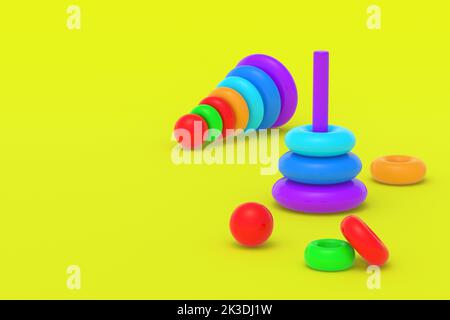 Toy pyramid towers on yellow background. Children education ...