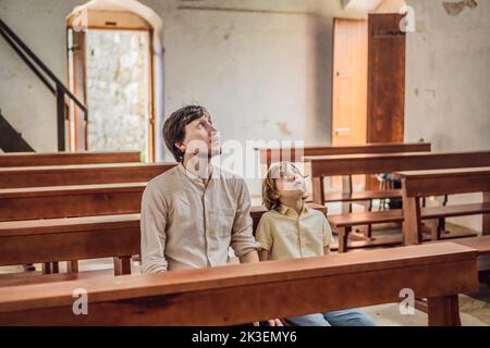 Christian dad tells his son Bible stories about Jesus sitting in kirk ...
