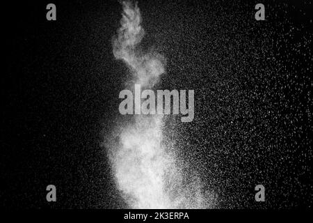 curly white steam and splashing water splashing isolated on black ...