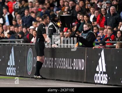 Referee Danny Makkelie checks the VAR for a possible penalty kick ...