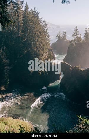 Overlooking an ocean arch in the Pacific Northwest on a warm dreamy day ...